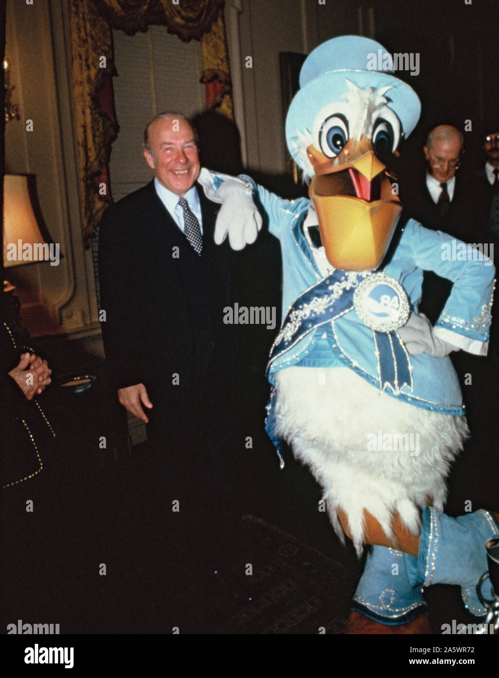 George Schultz and a mascot pose for pictures at the Department of ...