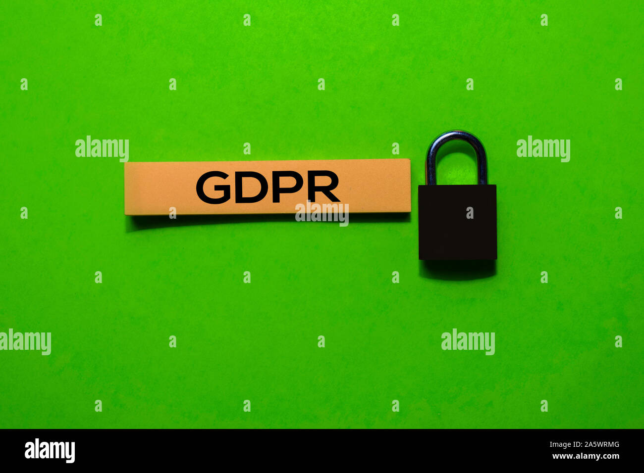 GDPR write on sticky notes and padlock. Isolated on green table ...