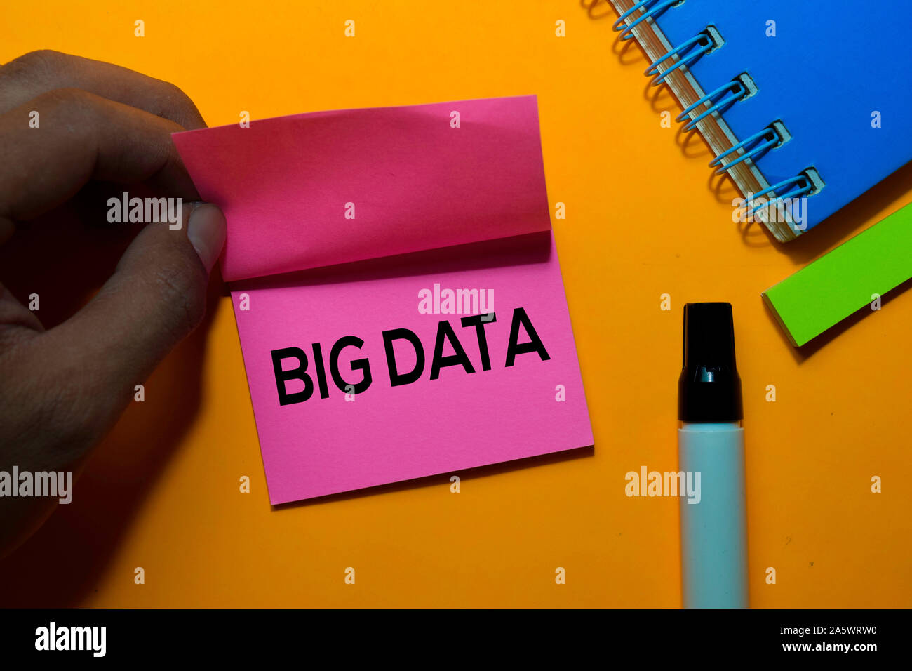 Big Data write on sticky notes. Isolated on orange table background ...