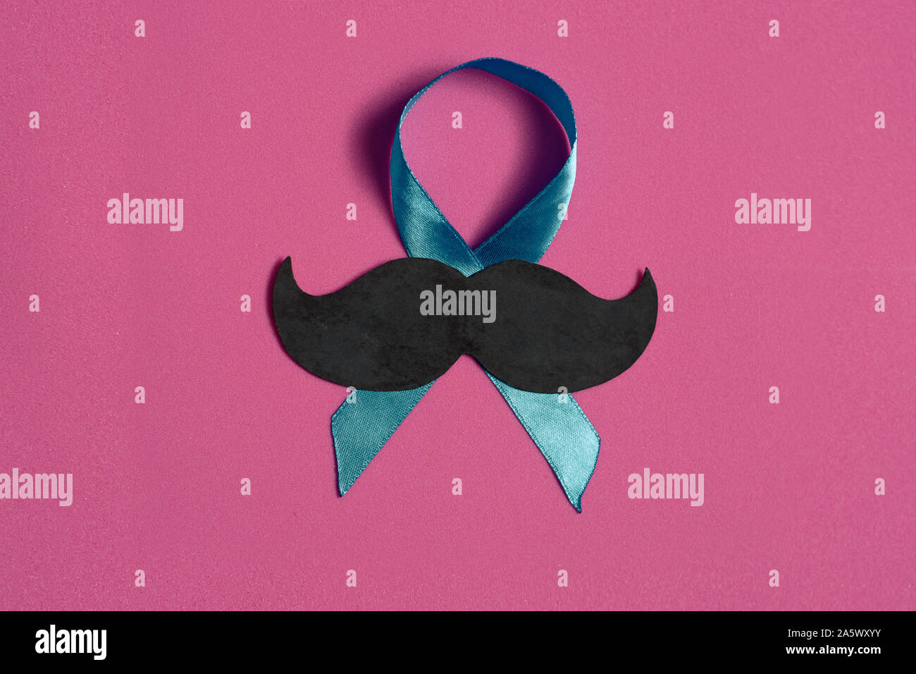 Moustache and blue ribbon on pink isolated background, international ...