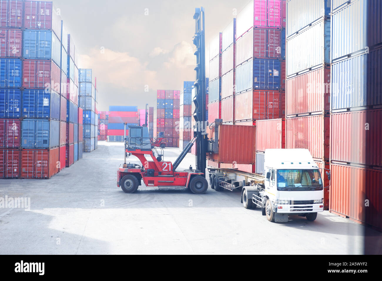 Container handlers in the harbor Work for import and export Stock Photo ...
