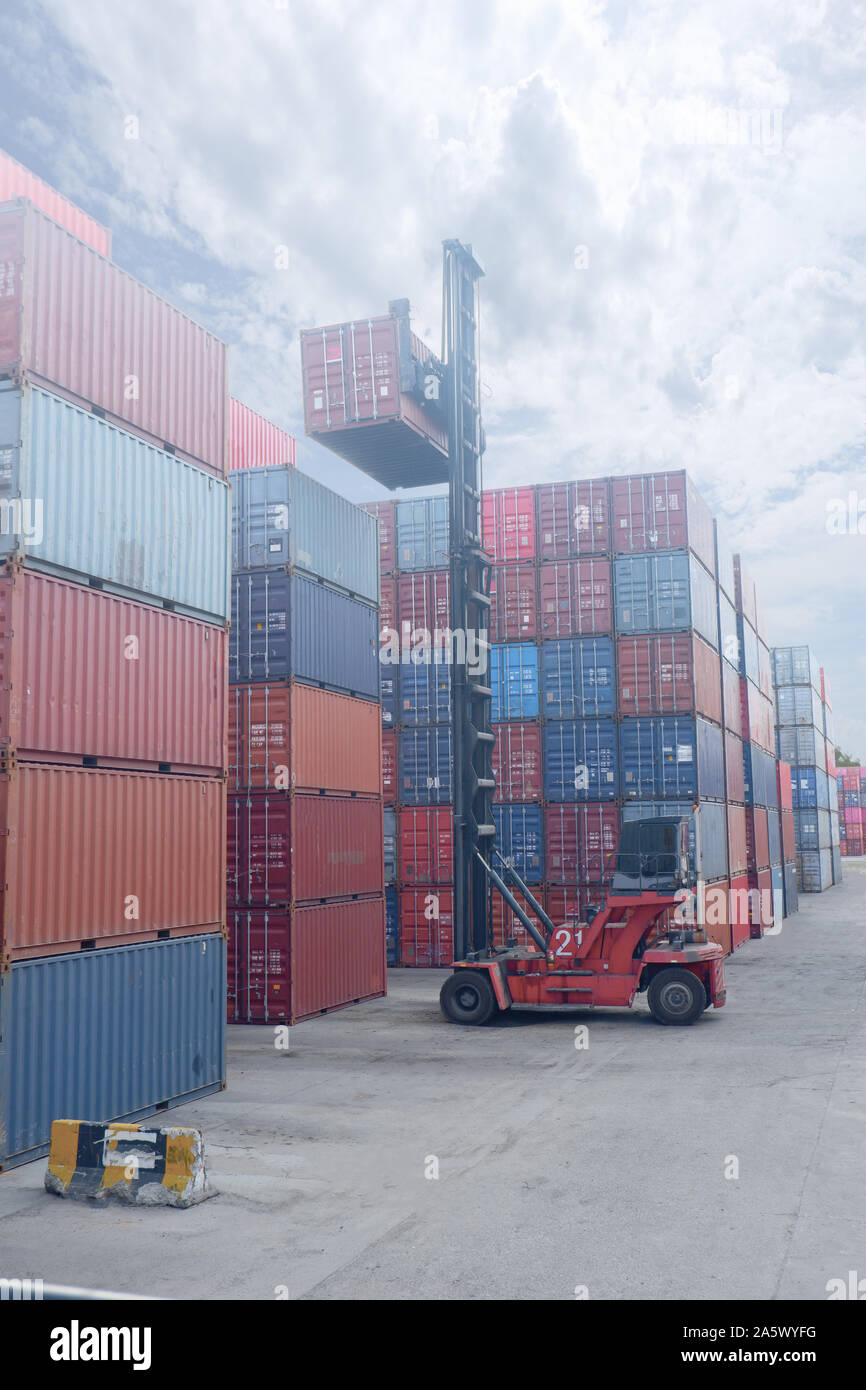 Container handlers in the harbor Work for import and export Stock Photo ...