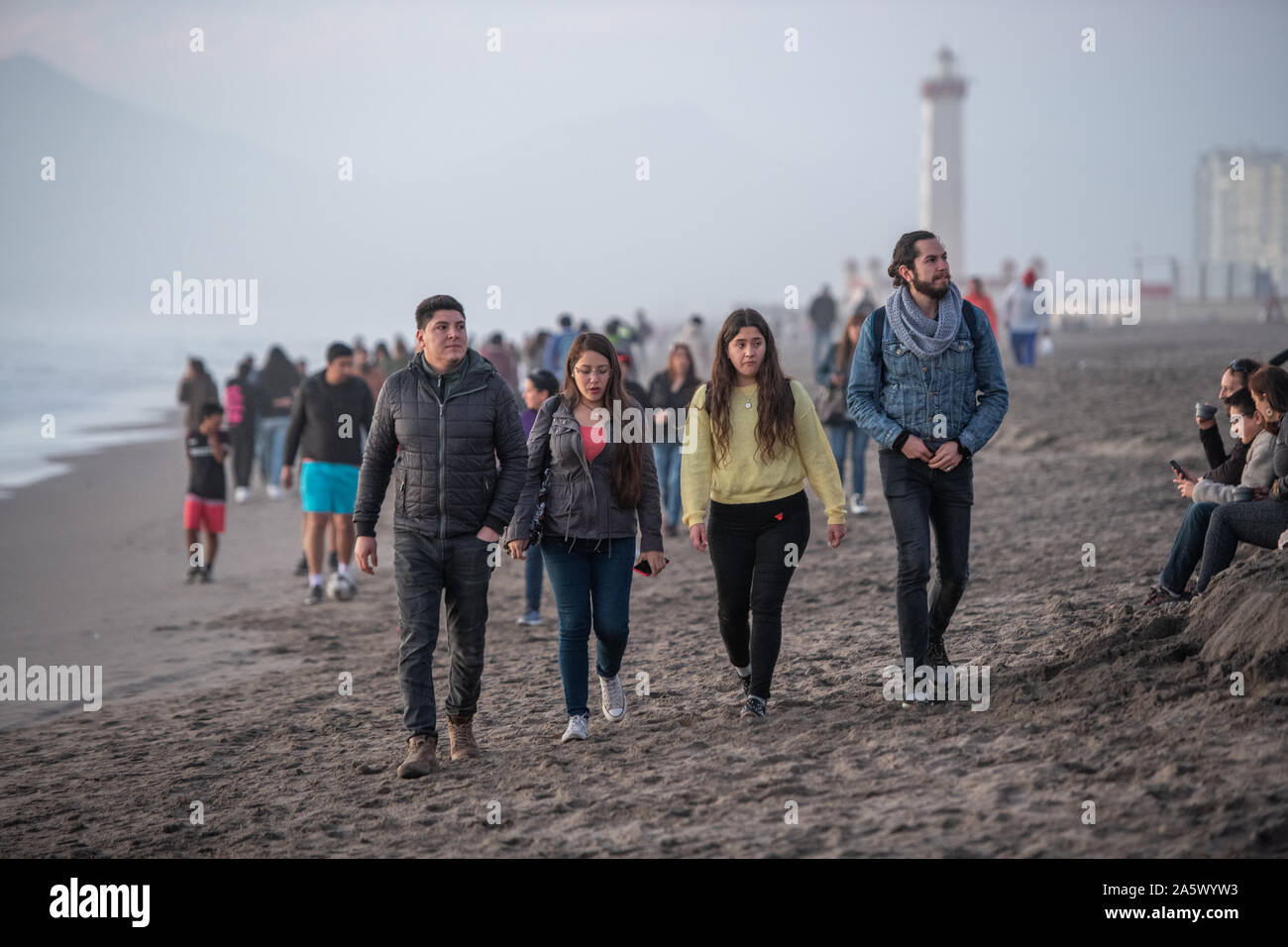 A group of people walk across the beaches of La Serena , Chile Stock ...