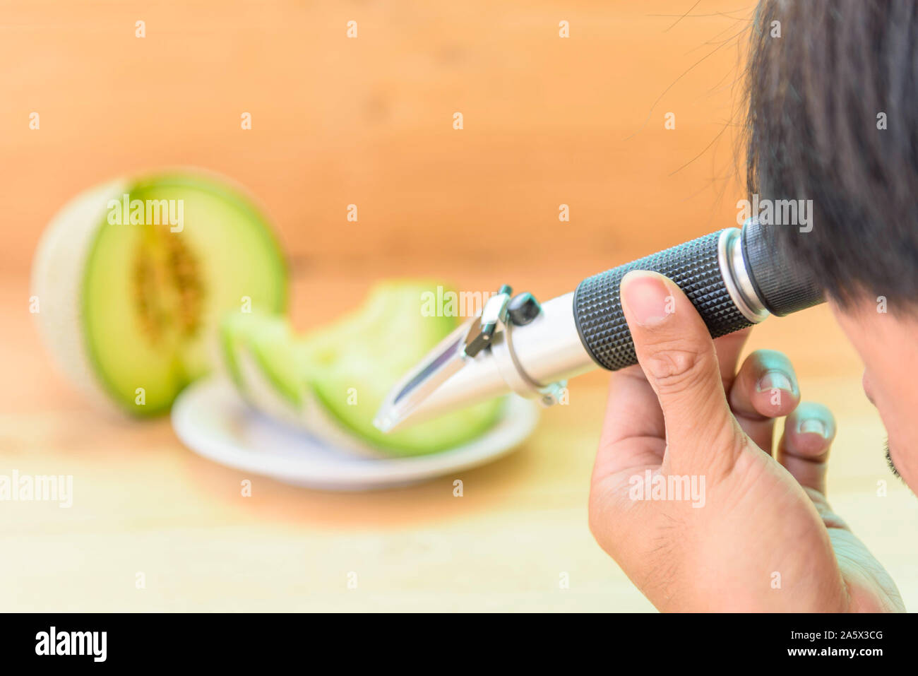 fresh melon for test sweet level Stock Photo - Alamy
