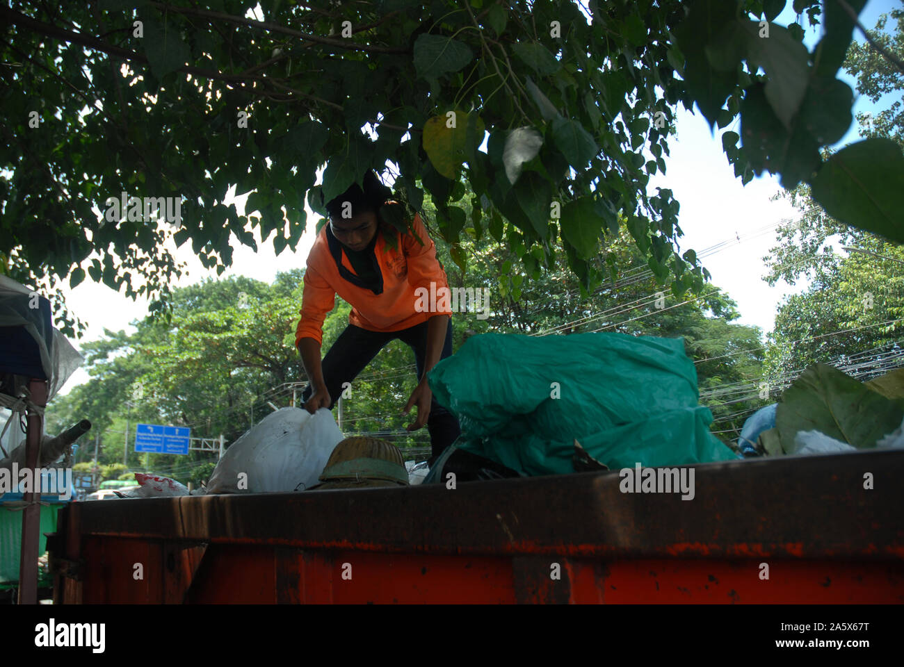 Boy collecting waste and rubbish, Yangon, Myanmar, Asia Stock Photo - Alamy