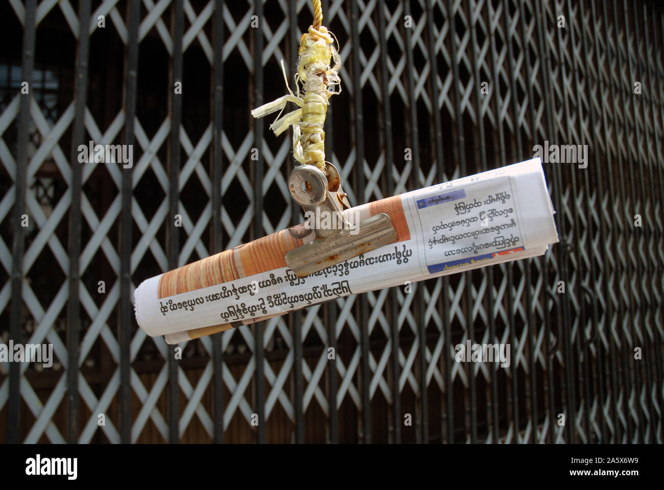 Newspaper hanging on a line, Yangon, Myanmar, Asia Stock Photo - Alamy