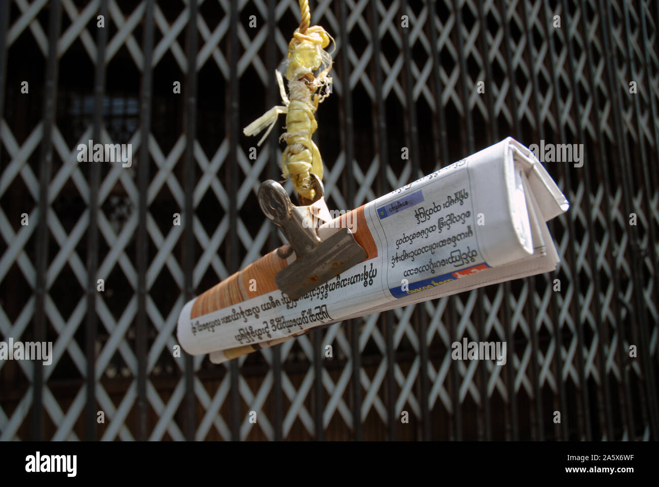 Newspaper hanging on a line, Yangon, Myanmar, Asia Stock Photo - Alamy