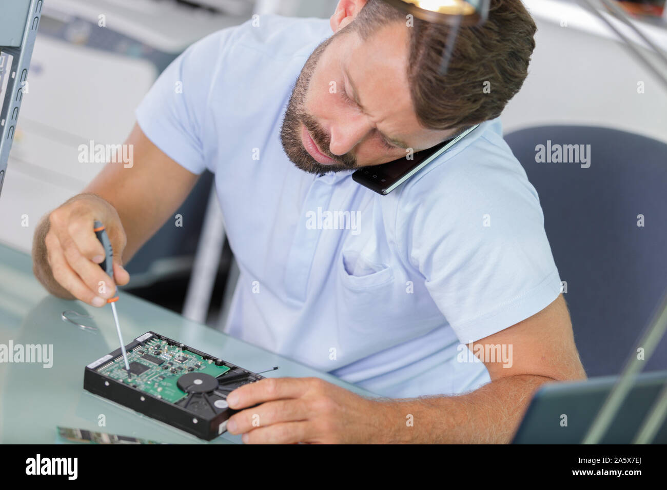 a pc technician at work Stock Photo - Alamy