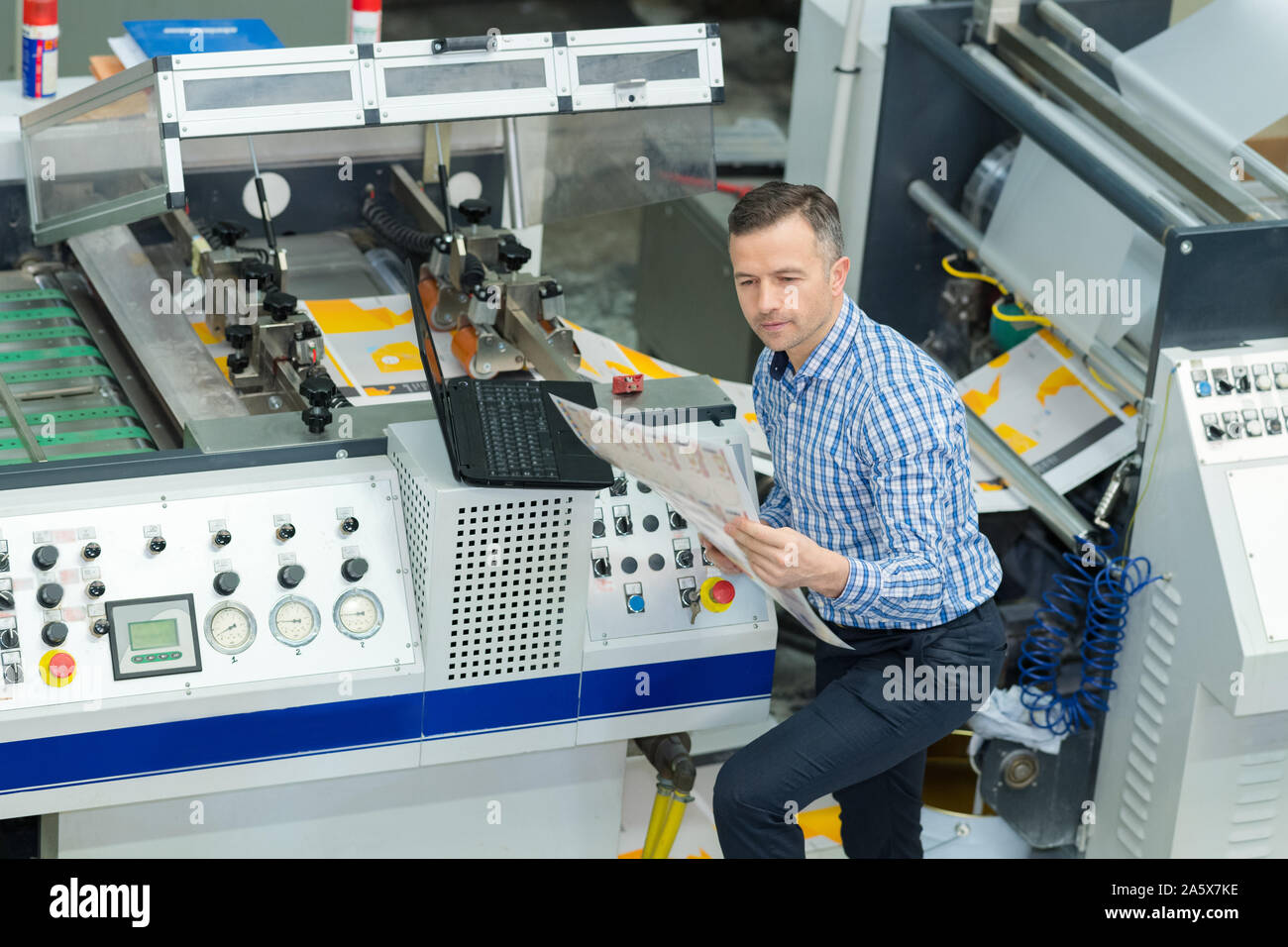 print production produce print operator Stock Photo - Alamy