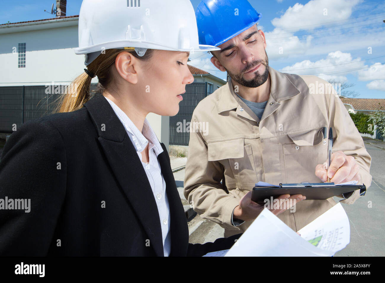 customer in stress and constructor foreman worker with helmet Stock ...