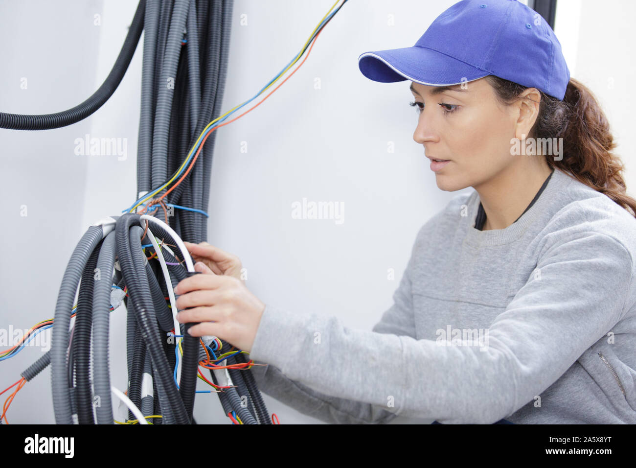 Builder woman working cables hi-res stock photography and images - Alamy