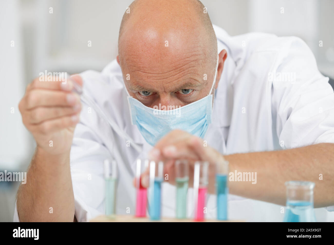mature lab technician doing medical research Stock Photo - Alamy