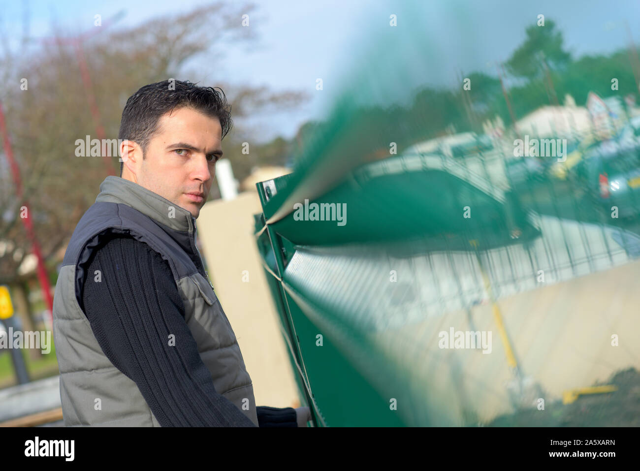 Man working on fence hi-res stock photography and images - Alamy