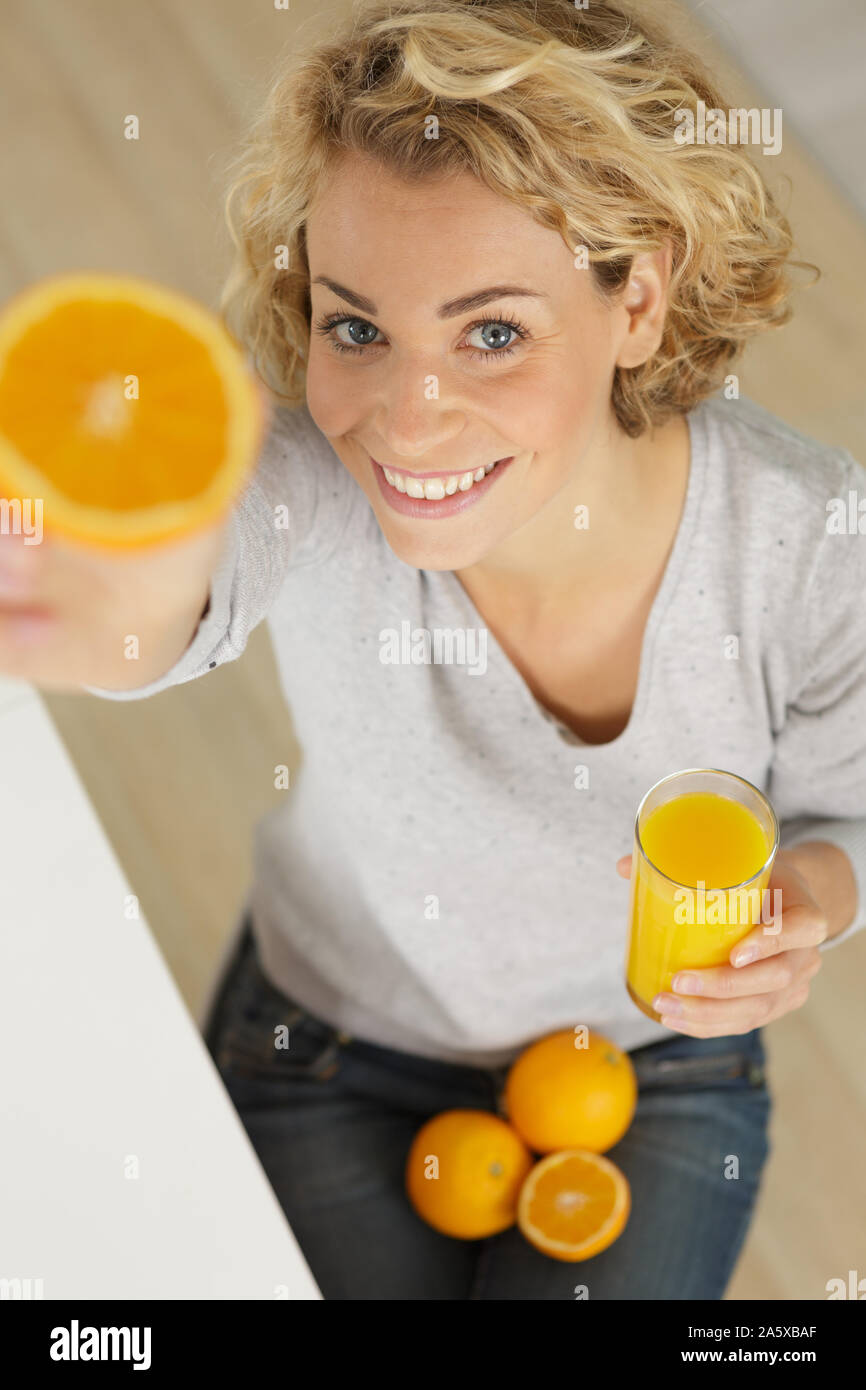 Woman presenting orange slice hi-res stock photography and images - Alamy