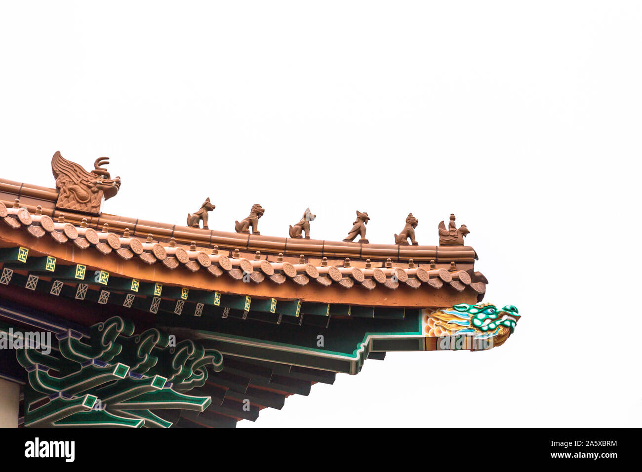 Common detailed chinese wooden roof top design with green and orange ...