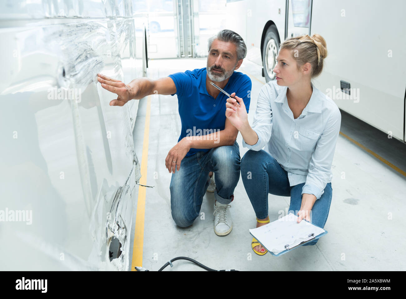 mechanic doing technical inspection on bus Stock Photo - Alamy