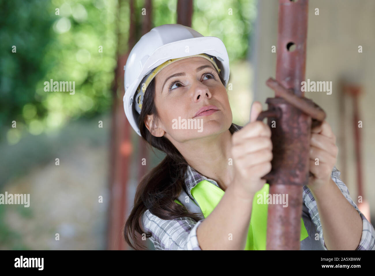 a female worker with pipe Stock Photo - Alamy