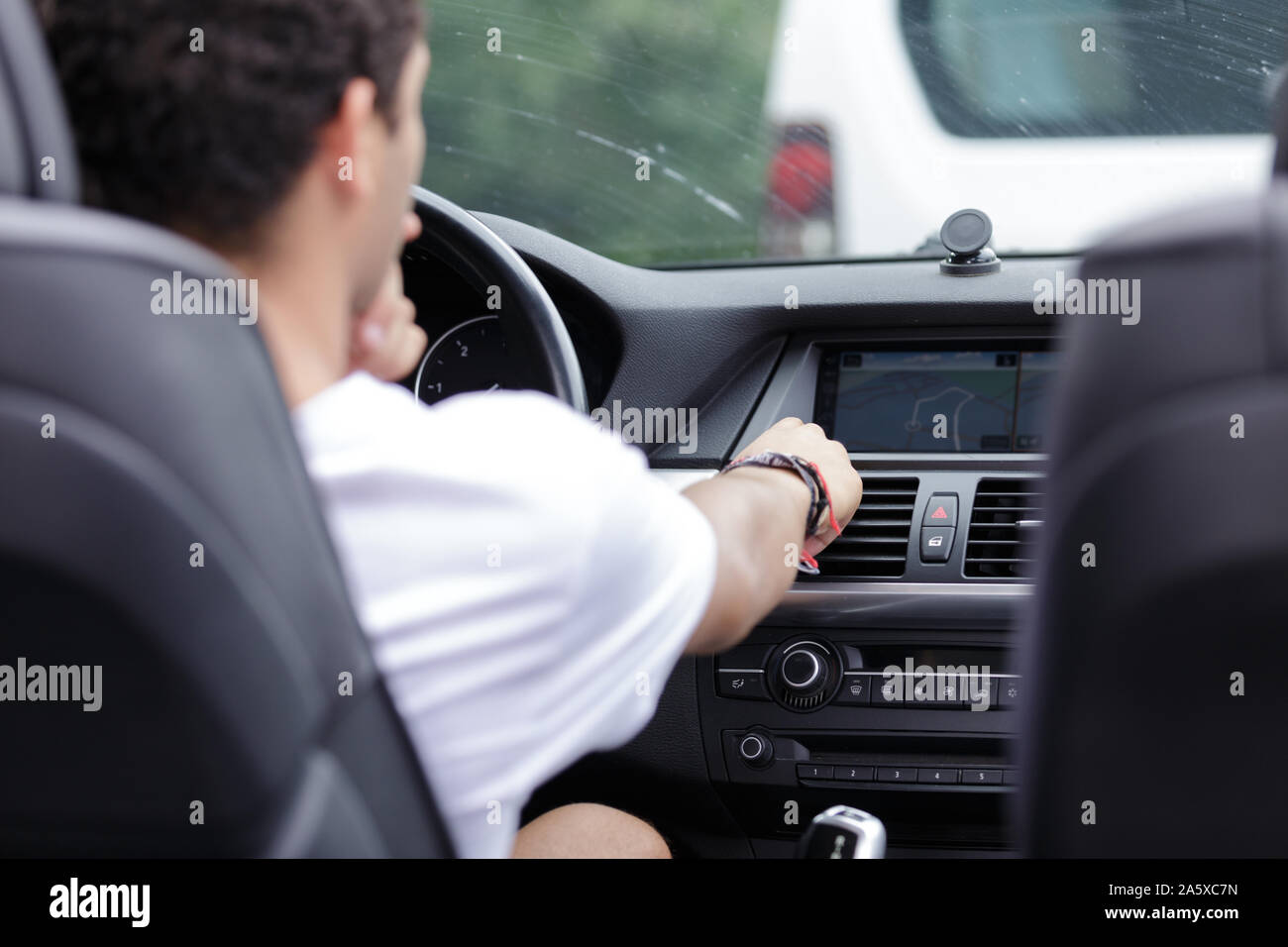 male driver putting navigation guide Stock Photo - Alamy