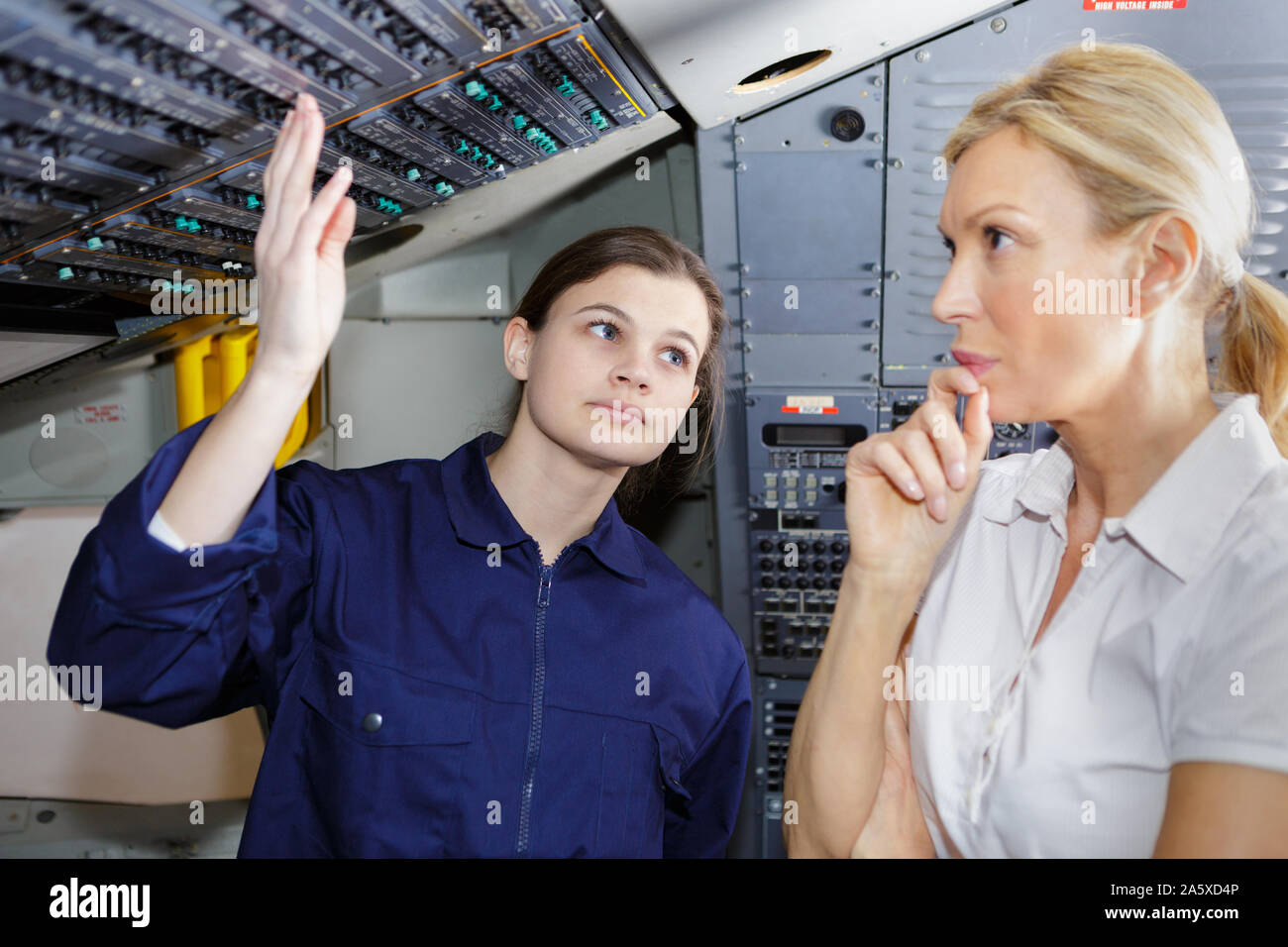 portrait of woman training a female apprentice Stock Photo - Alamy