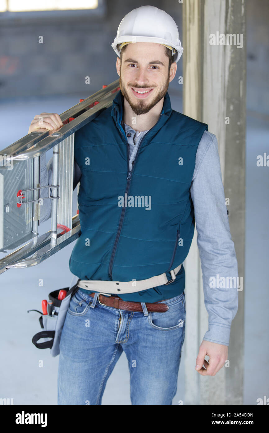 Man carrying ladder hi-res stock photography and images - Alamy