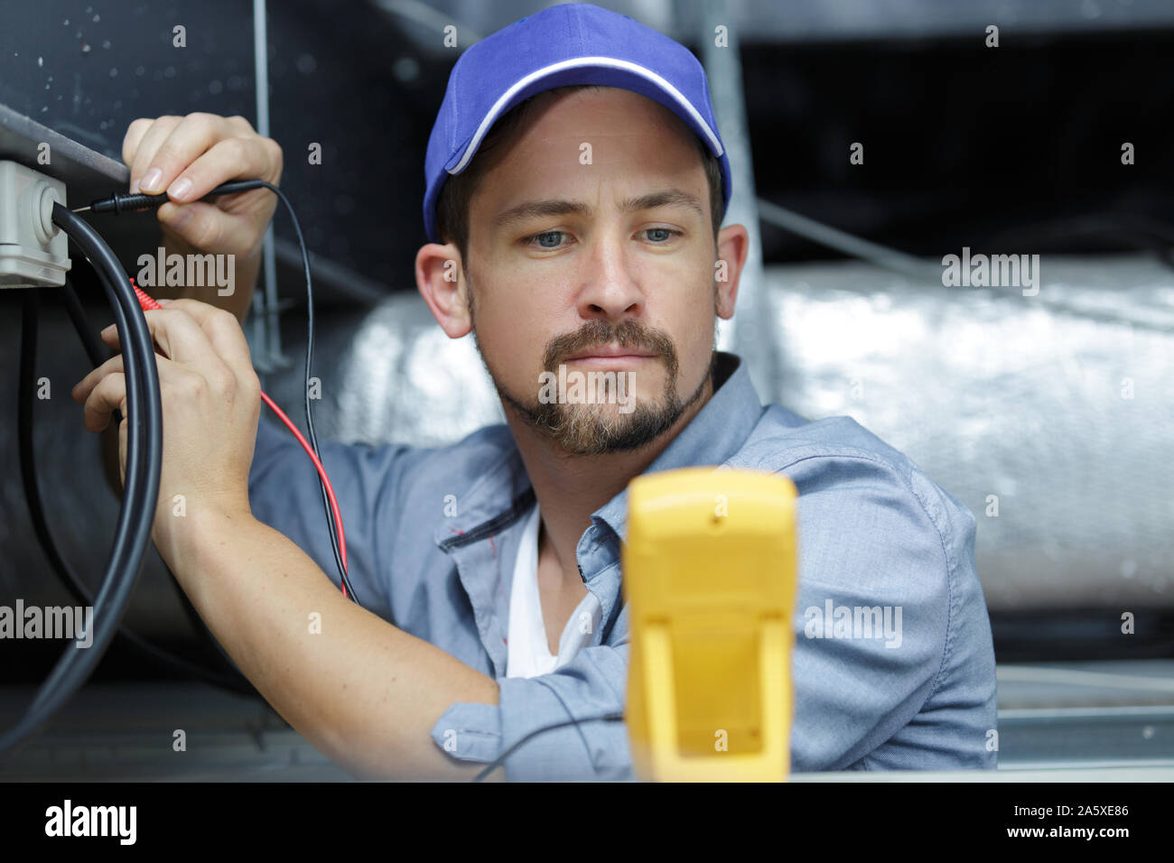 check the electrical system in the factory Stock Photo - Alamy