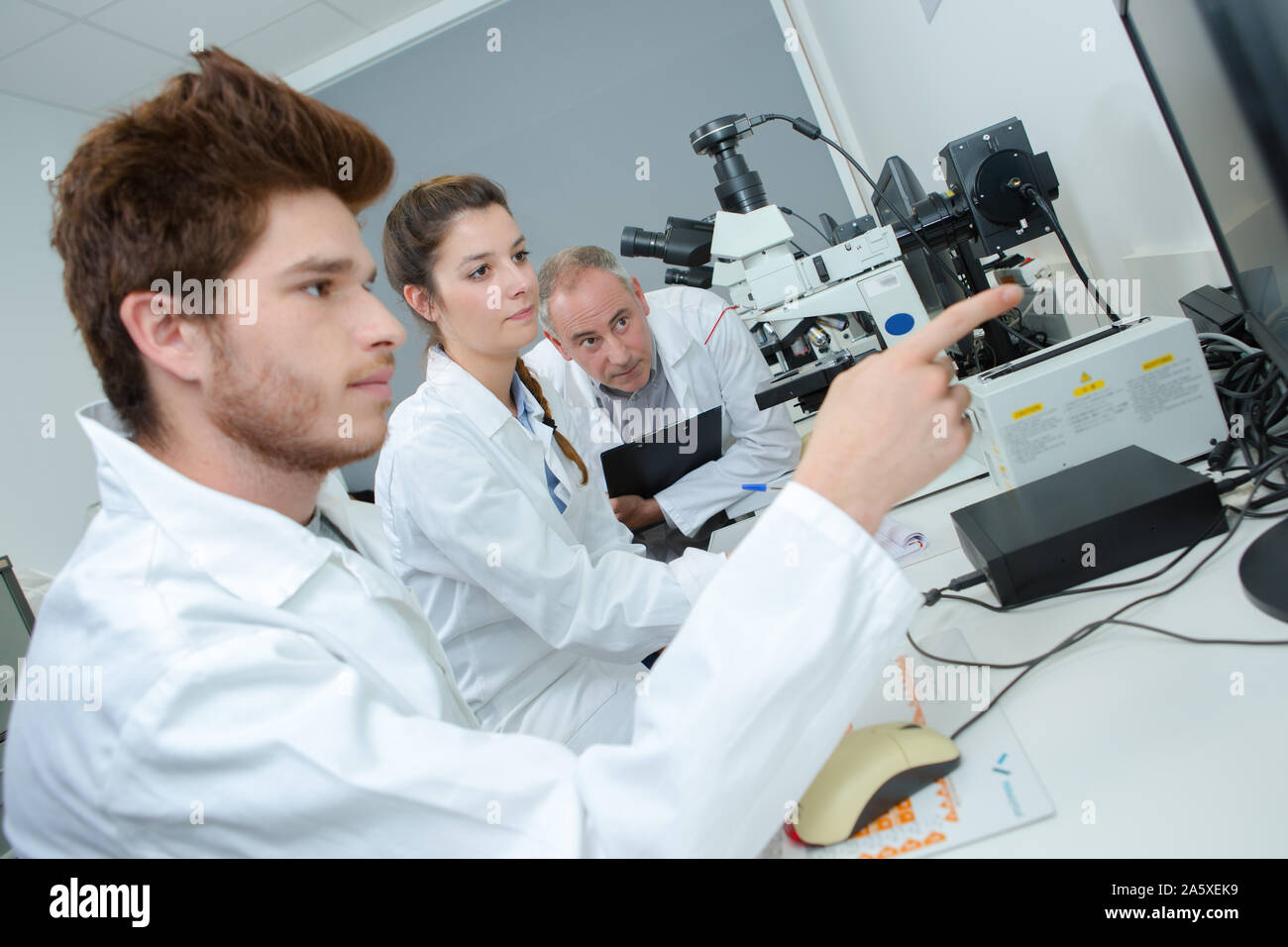 Students sat at desk in laboratory Stock Photo - Alamy