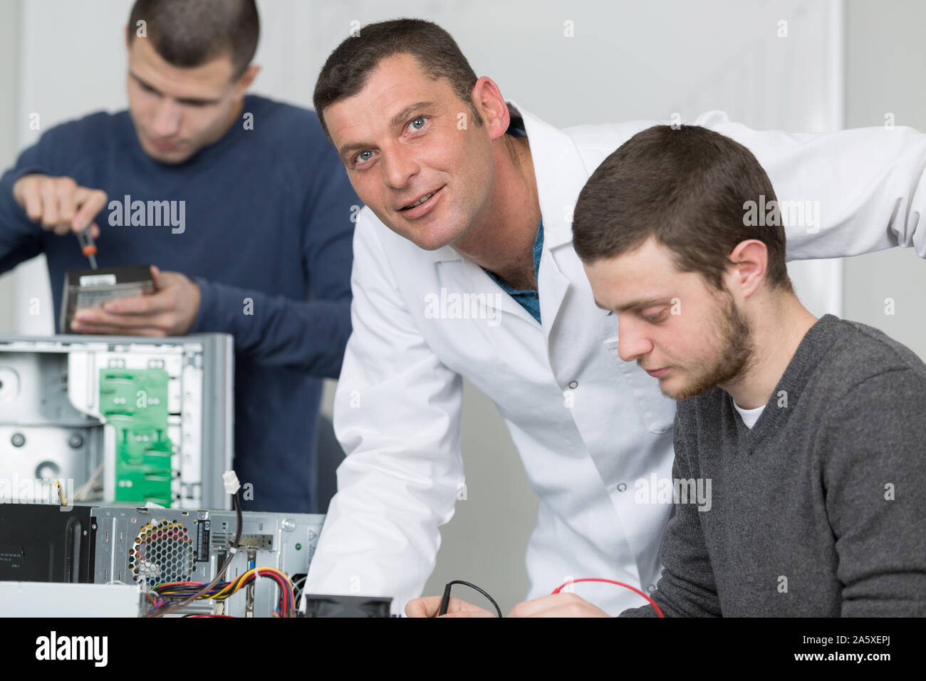 student and teacher in electrical engineering course Stock Photo - Alamy