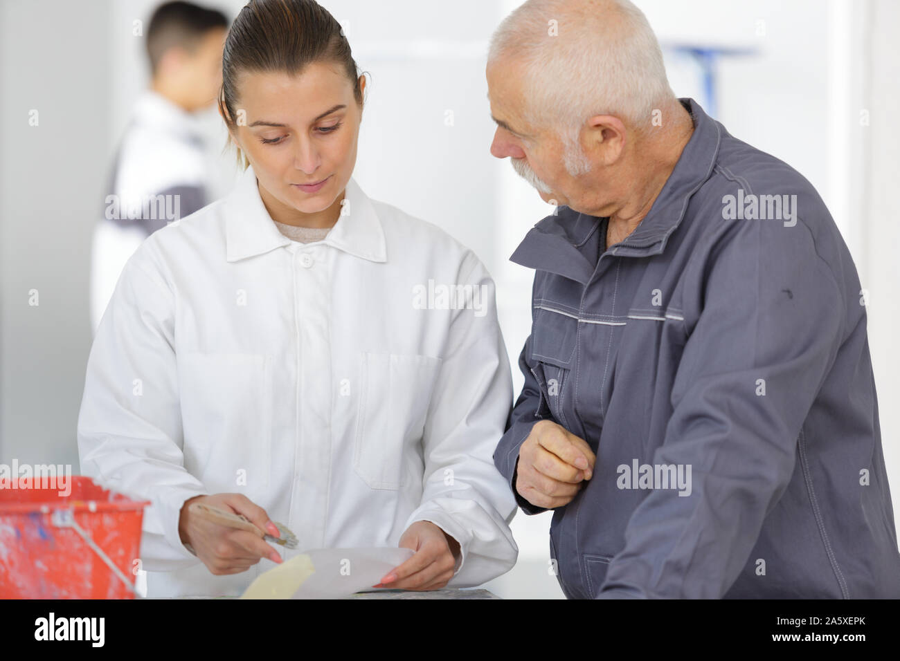 female commercial painting apprentice studying the concept Stock Photo ...
