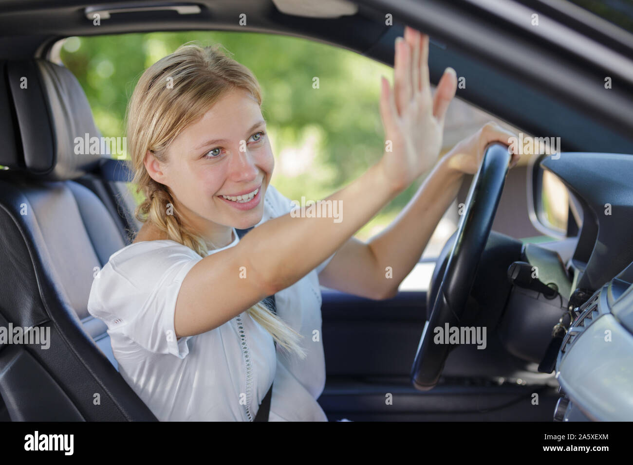 Driver waving hi-res stock photography and images - Alamy