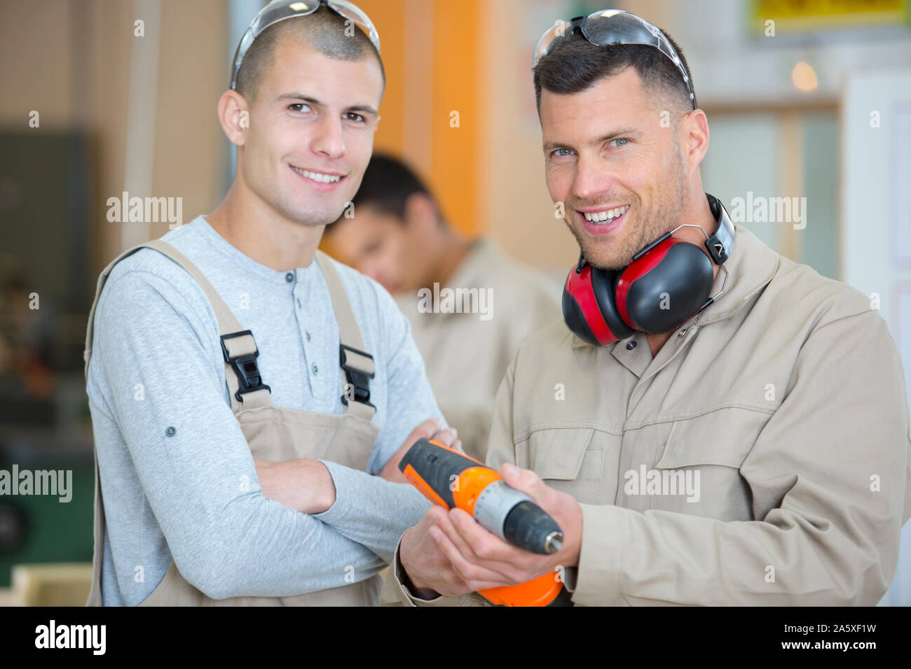 men before drilling the wall Stock Photo - Alamy