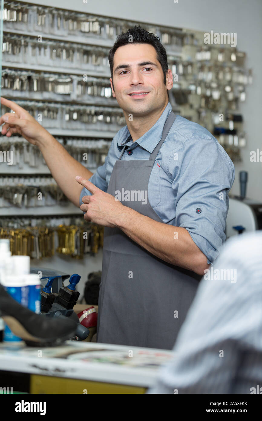 key smith pointing on a key Stock Photo - Alamy