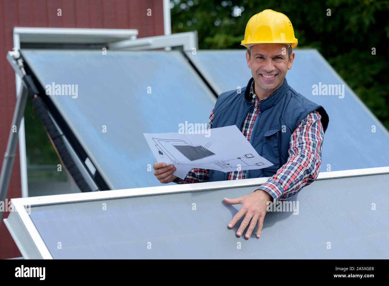a man working at solar panels Stock Photo - Alamy
