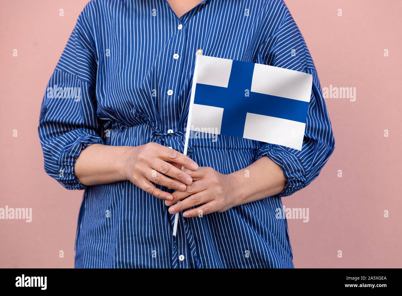 Hand holding finnish flag outside hi-res stock photography and images ...
