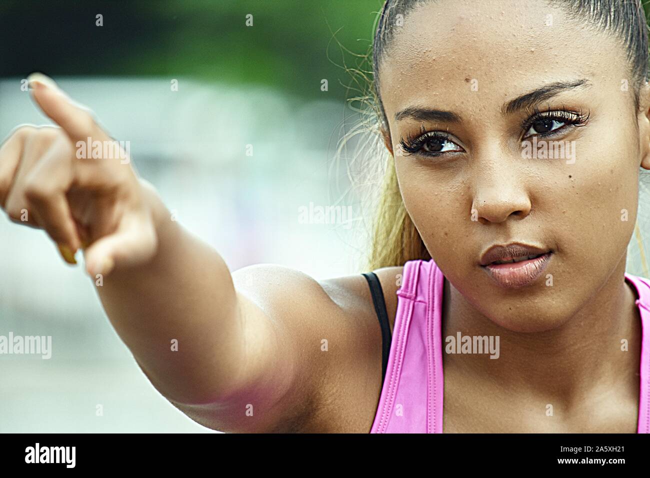 An Athletic Female Pointing Stock Photo - Alamy
