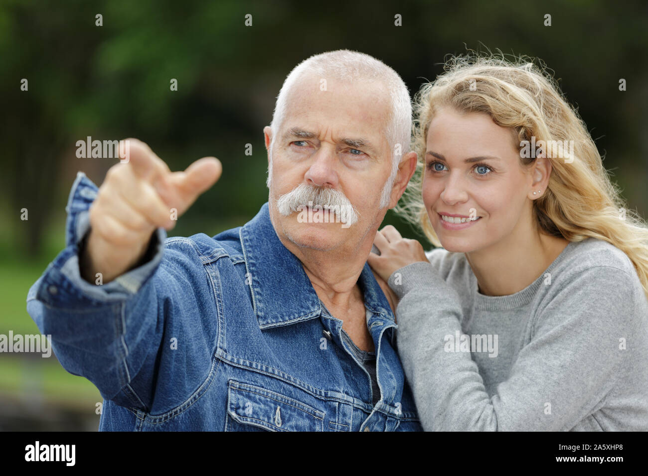 a family pointing at something Stock Photo - Alamy