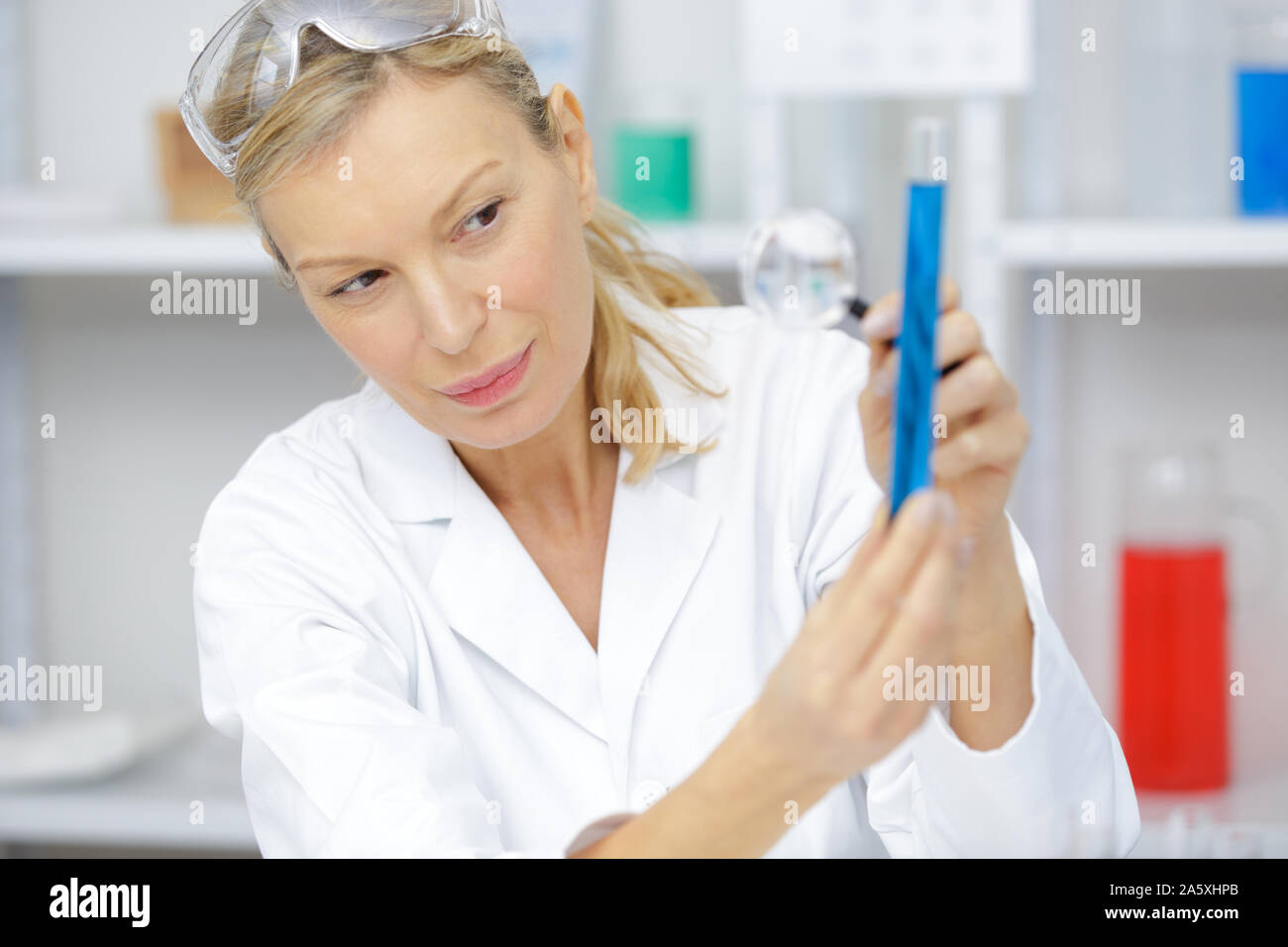 mature scientist researching blood in laboratory Stock Photo - Alamy