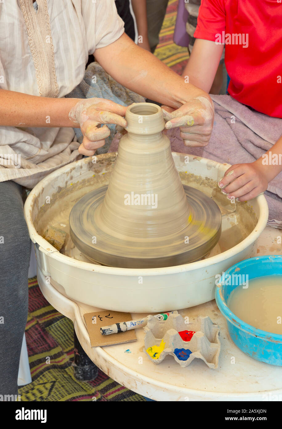 potter teaches children how to make beautiful clay products Stock Photo ...