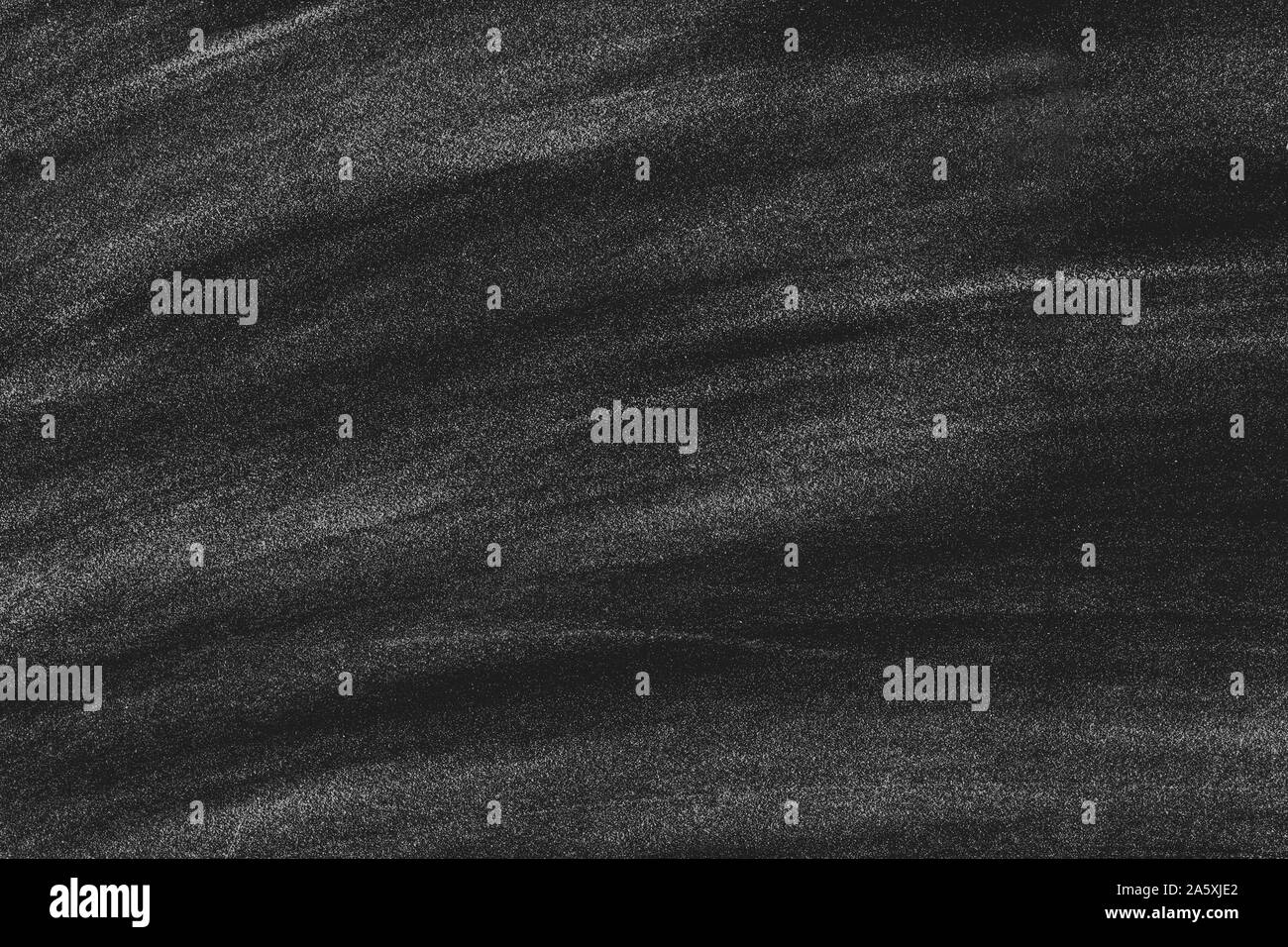 Dirty chalkboard background. Whte chalk stains on blackboard after ...