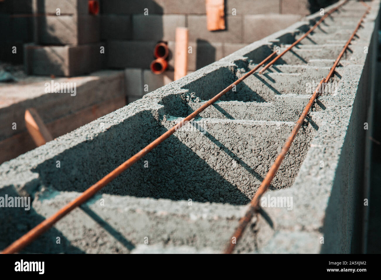 Bricks on a building foundation Stock Photo - Alamy