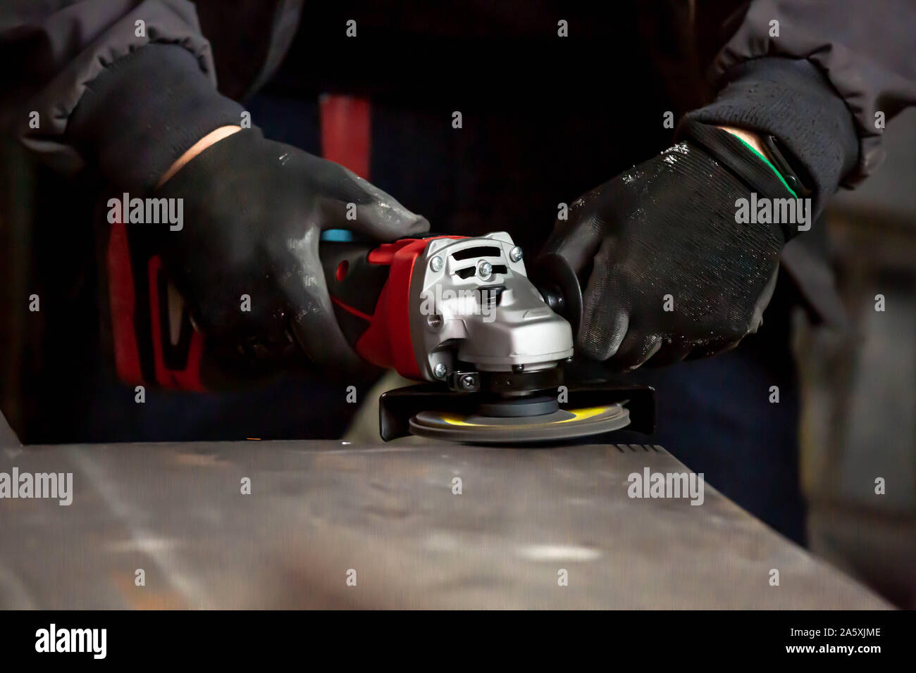 Hands man working grinder hi-res stock photography and images - Alamy