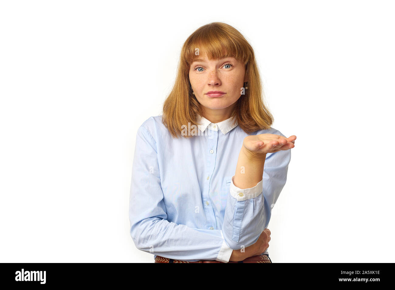 Cute redheaded young woman looking perplexed and disappointed. Image of ...