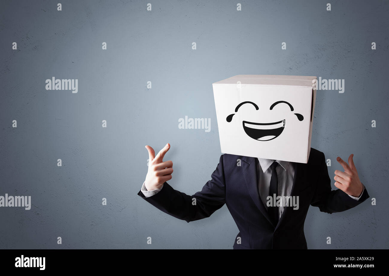 Funny man wearing cardboard box on his head with smiley face Stock ...
