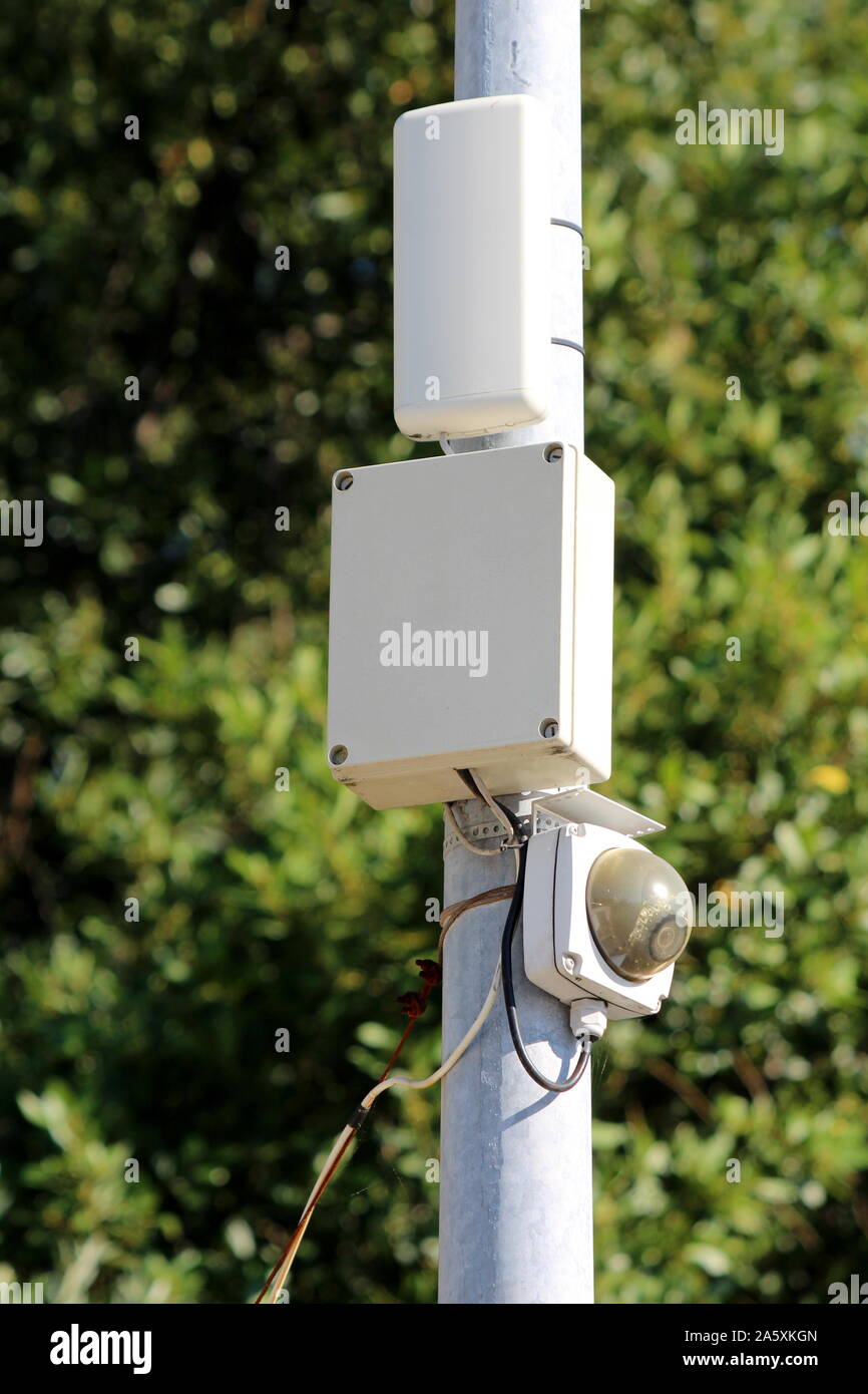 Surveillance equipment mounted on tall metal pole with closed circuit ...
