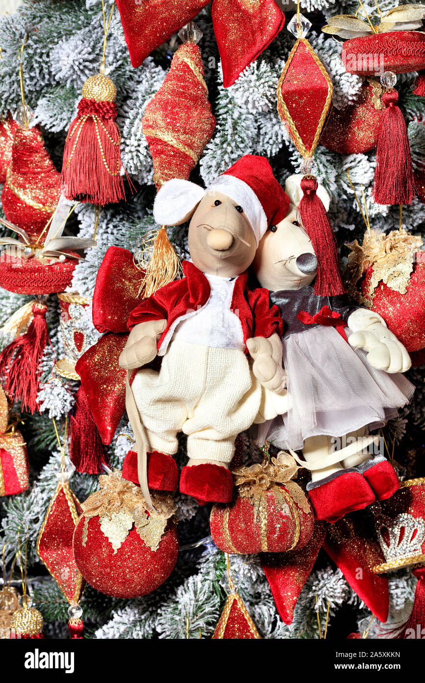 Pair of decorative toy mice is festively dressed in red clothes on the ...