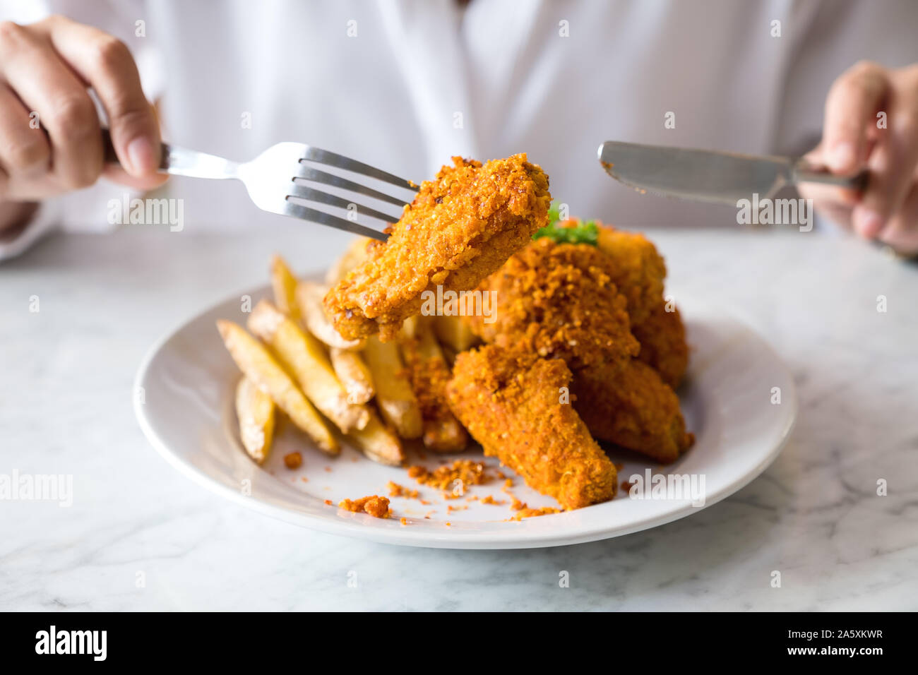 Hand holding french fries in hi-res stock photography and images - Alamy