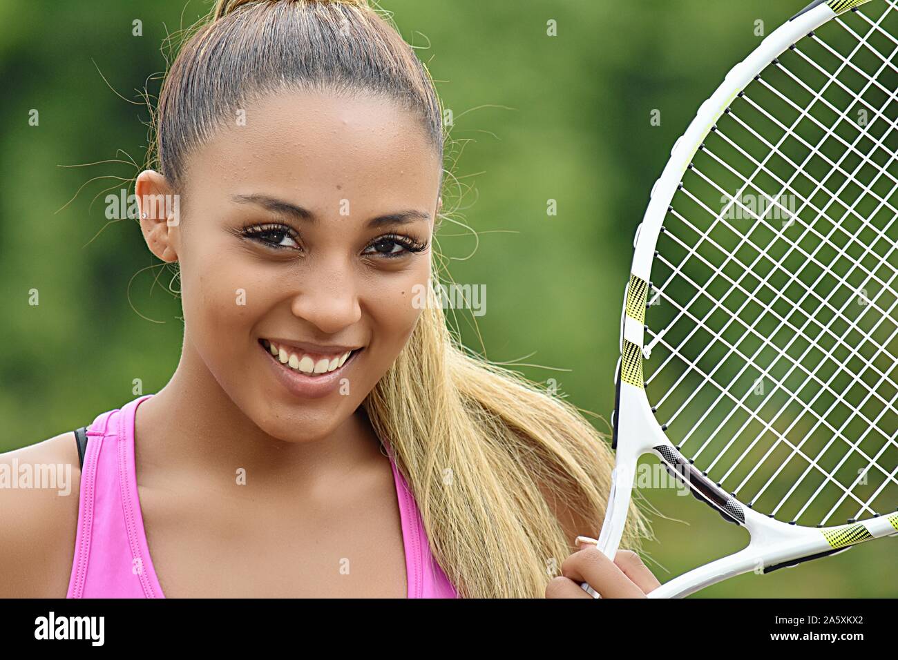 Smiling Fit Female Tennis Player Stock Photo - Alamy