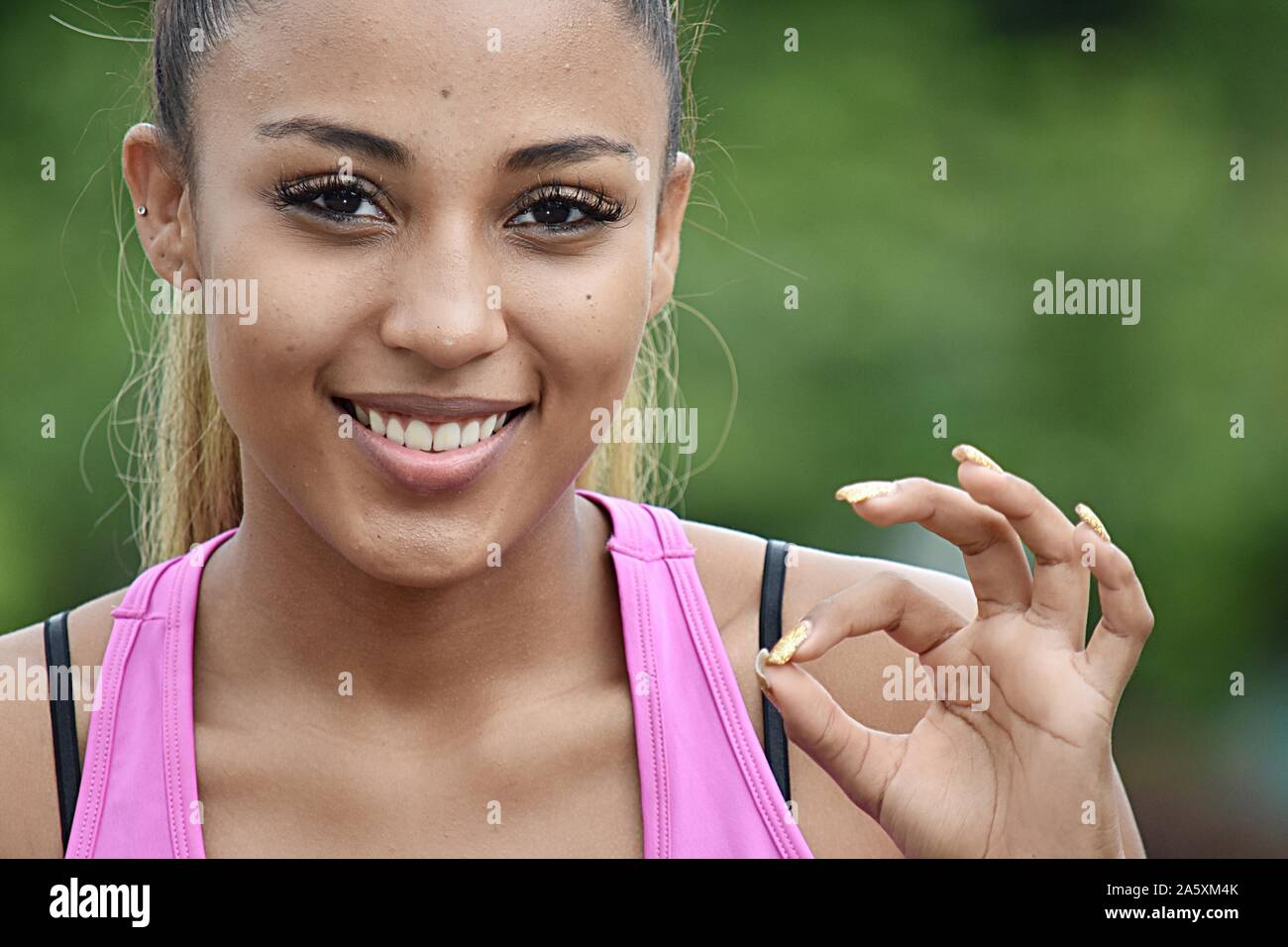 An Athlete Female And Okay Sign Stock Photo - Alamy
