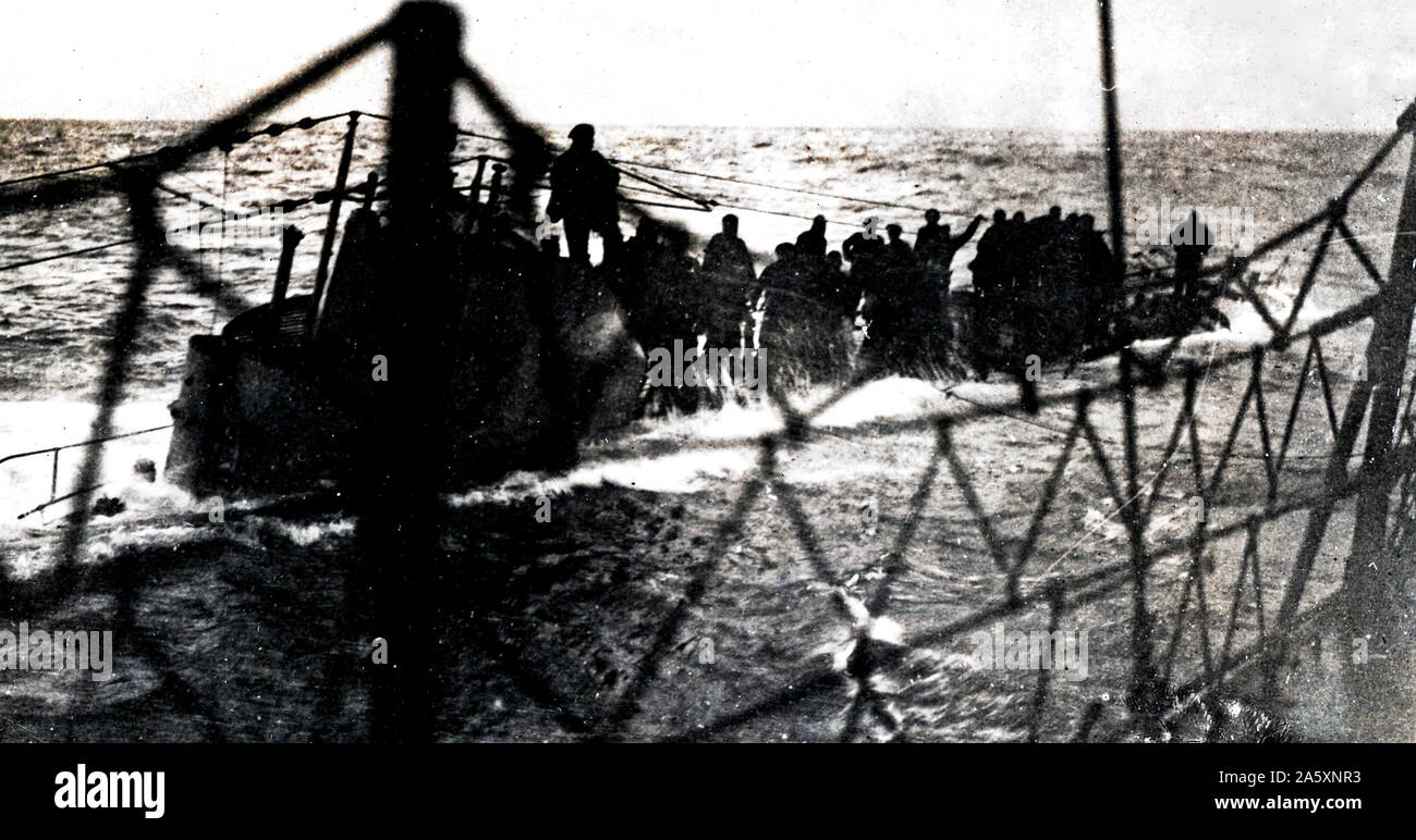 A view of the captured Germans on the deck of the sinking U-boat, sunk ...