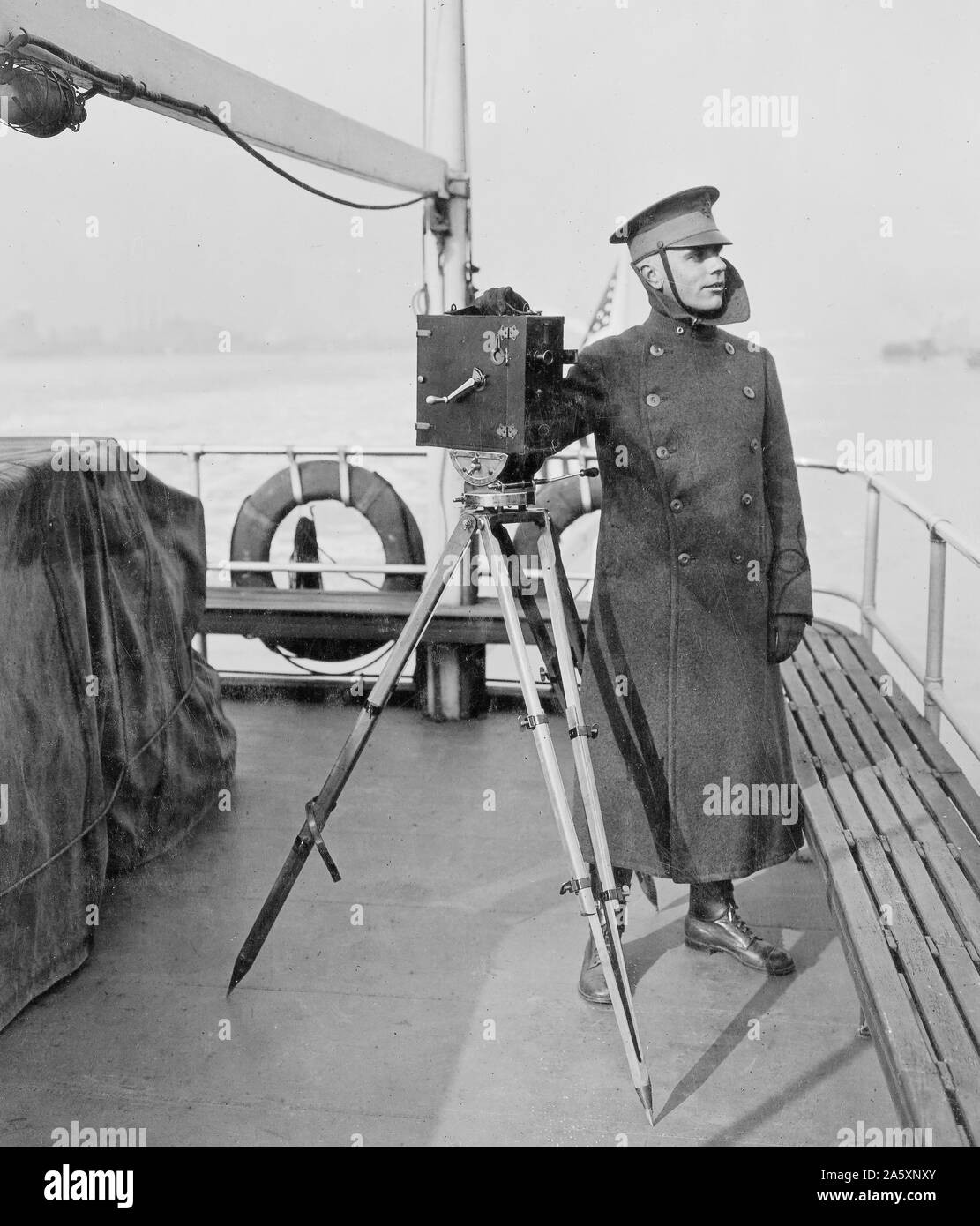 Photographer on deck of vessel to take a photo of ship being launched ...