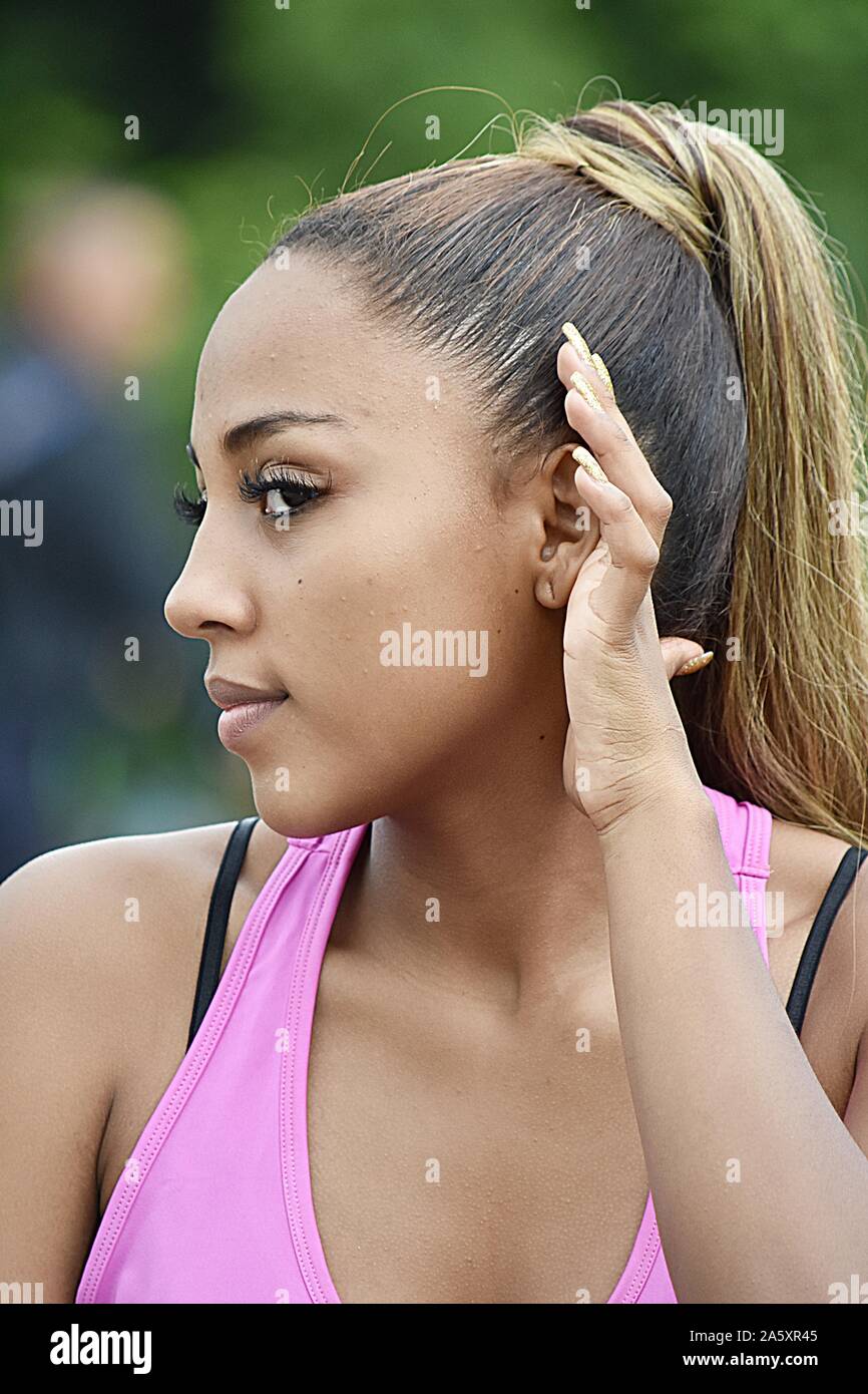 Listening Fit Female Stock Photo - Alamy